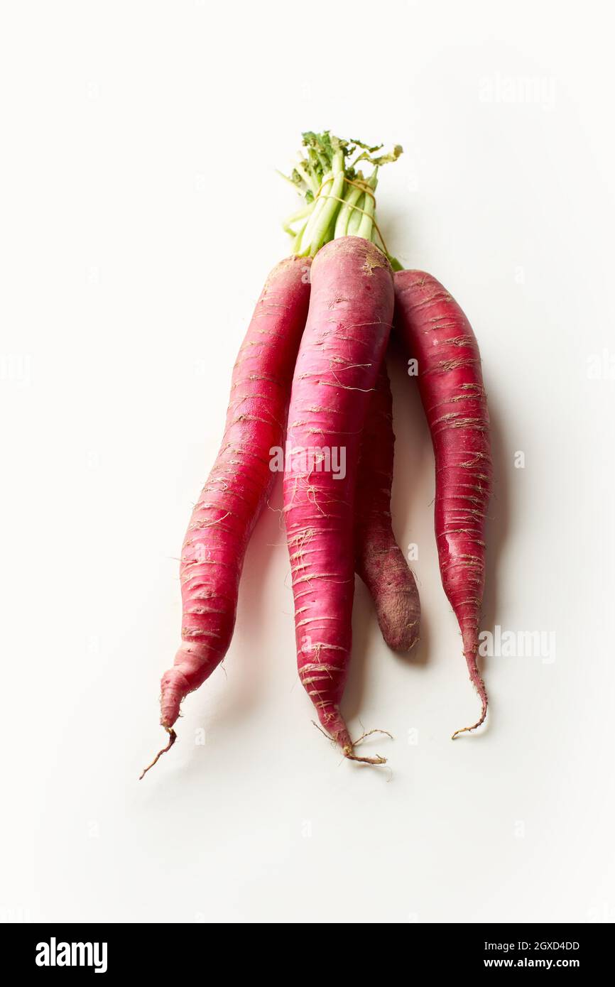 Red daikon radish on white background. Healthy asian ingredient for ...