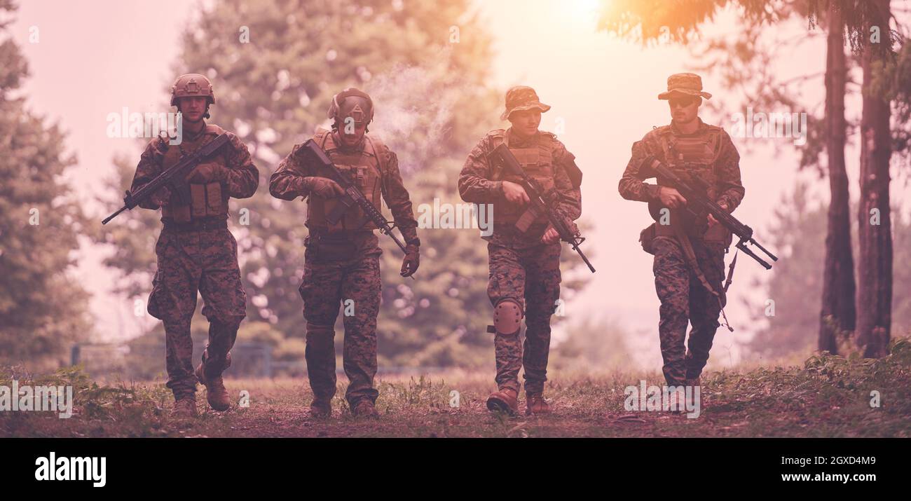 soldiers squad relaxed walking after battle Stock Photo - Alamy