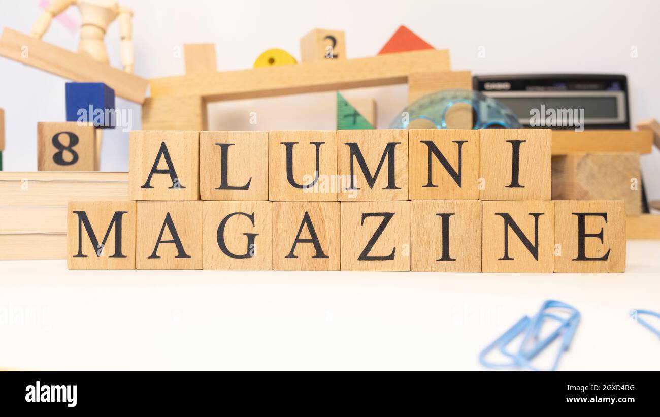 The word Alumnus magazine was created from wooden cubes Stock Photo - Alamy