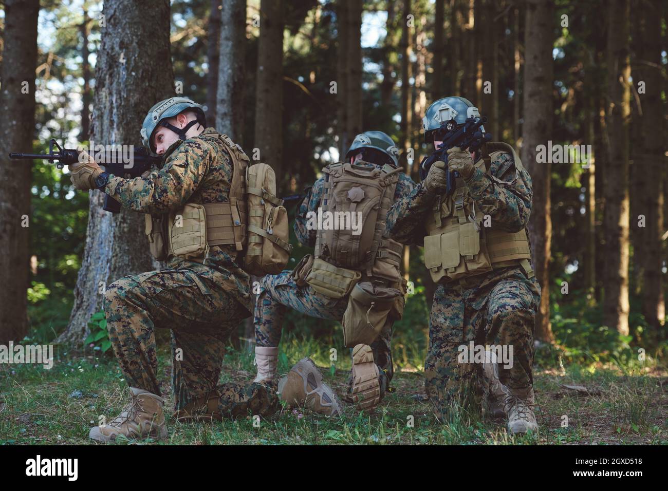 Soldier fighters standing together with guns. Group portrait of US army ...