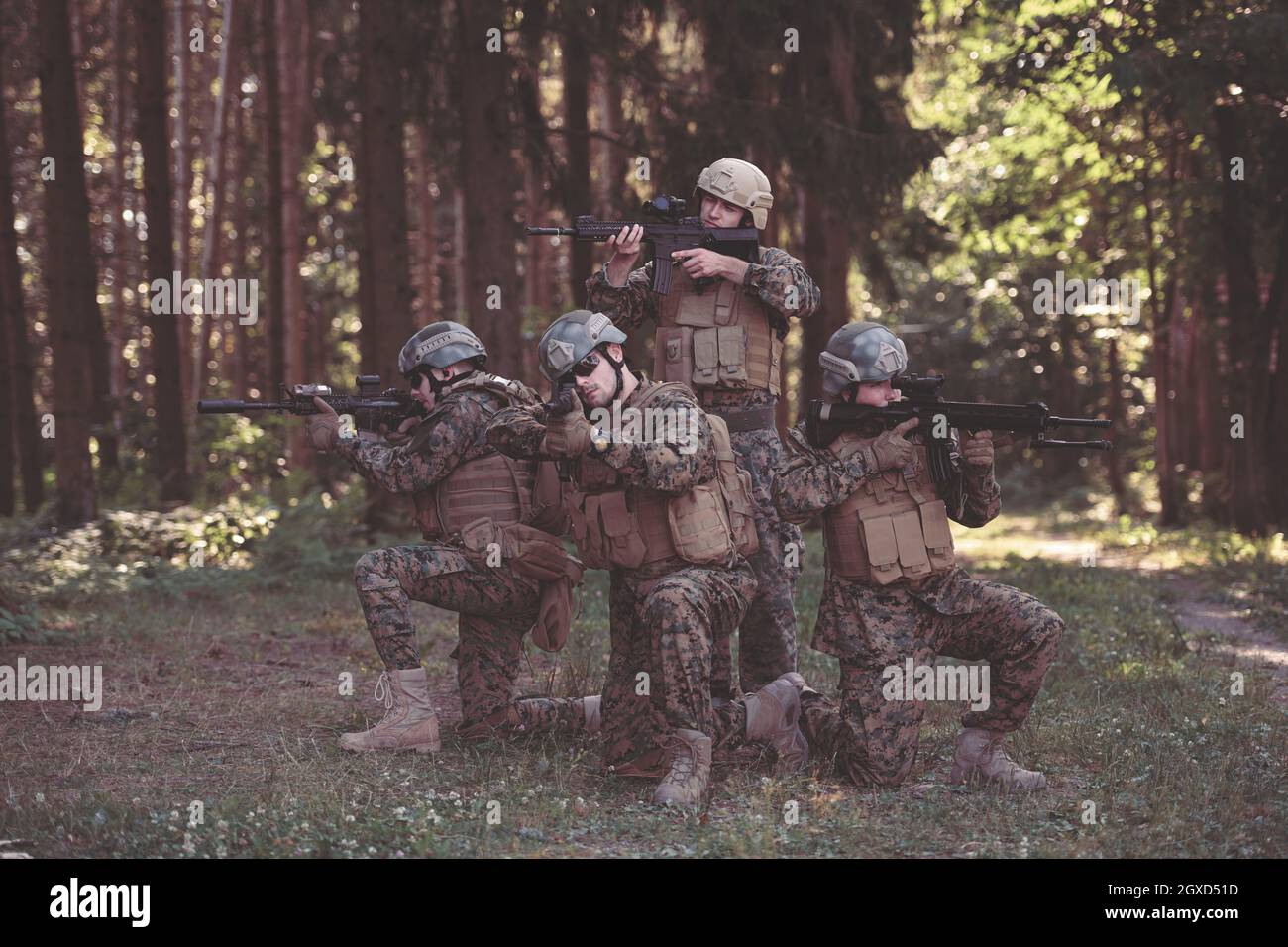 Soldier fighters standing together with guns. Group portrait of US army ...