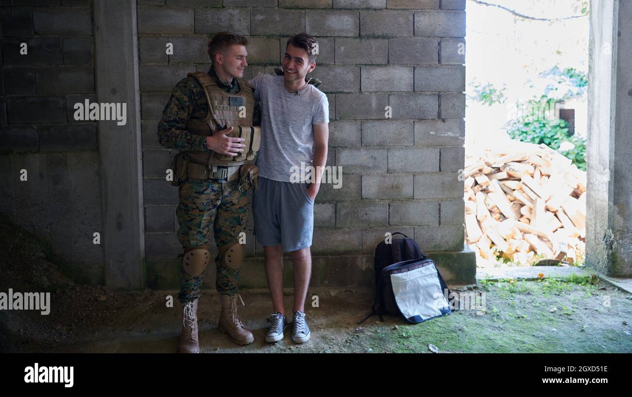 a brother hugs a soldier homecoming end of military serving or sendoff ...