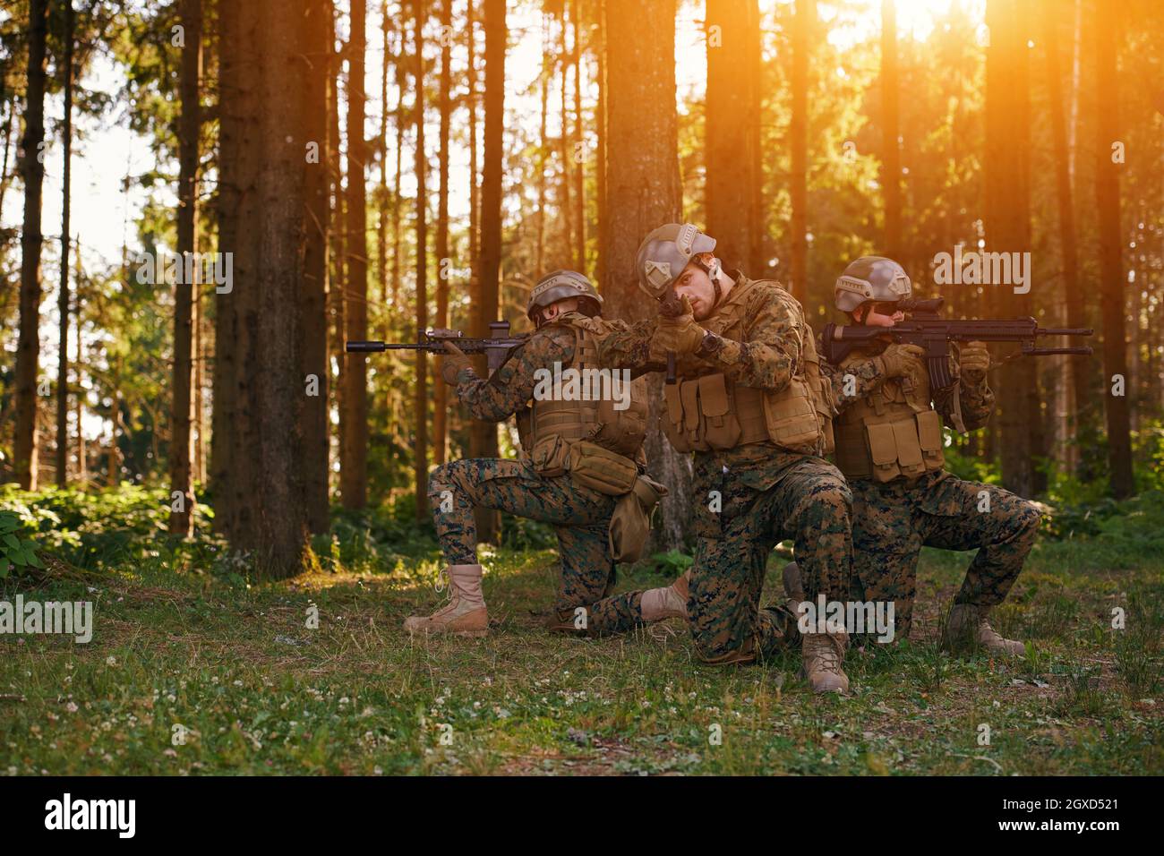 Soldier fighters standing together with guns. Group portrait of US army ...