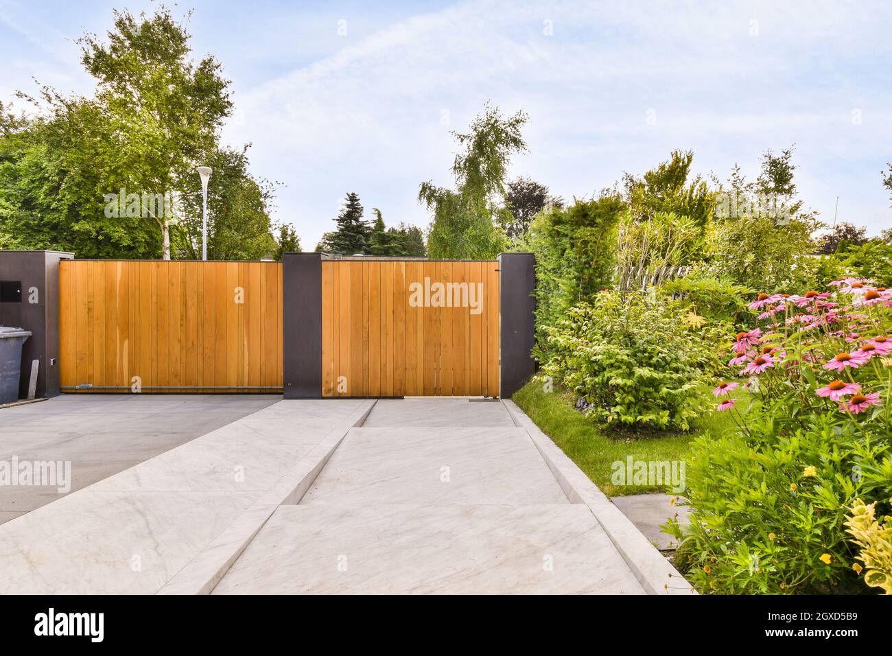 Wooden gates of contemporary residential cottage with minimalist ...