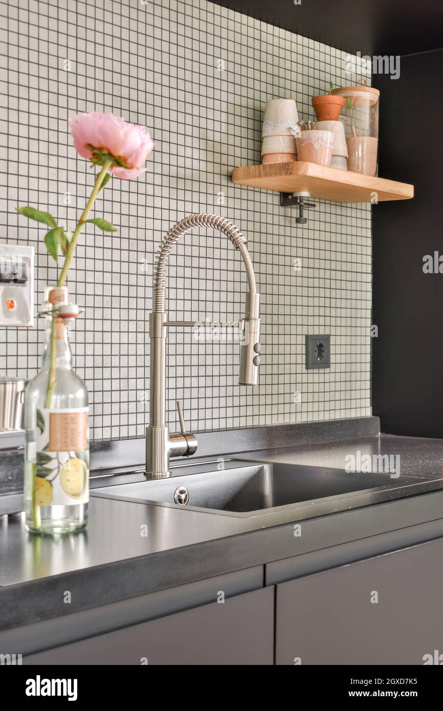Detail of interior design of modern kitchen with faucet and sink ...
