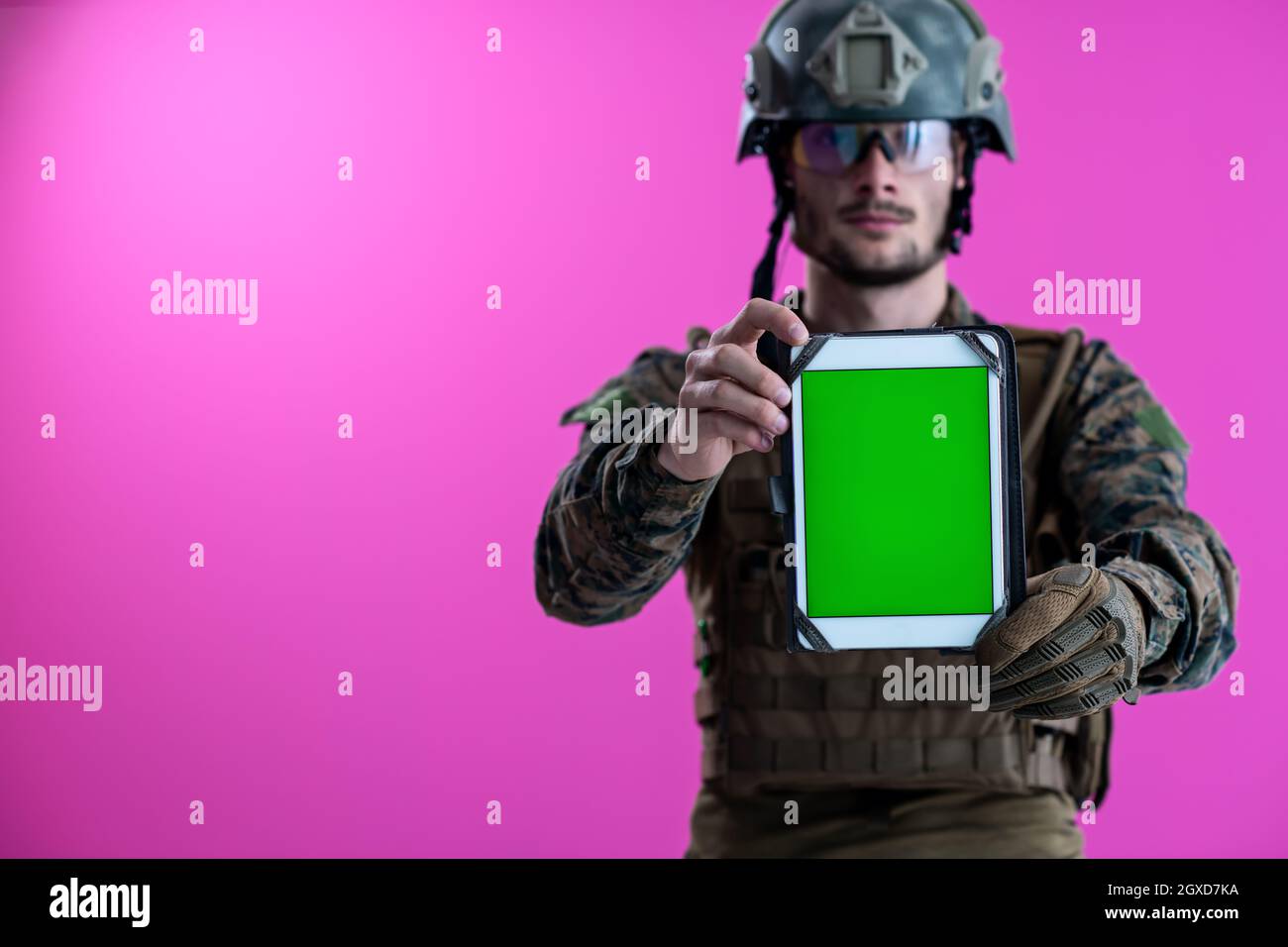 army soldier showing a tablet computer with a blank green screen ...