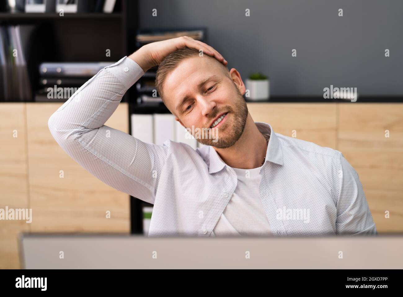 Office Ergonomics Neck Ache Stretching Exercise At Desk Stock Photo - Alamy