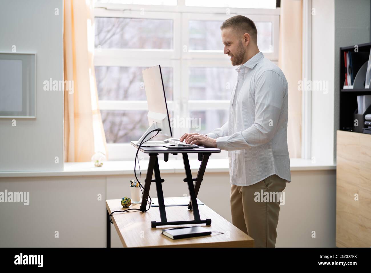 Adjustable Height Desk Stand For Office Computer Stock Photo - Alamy