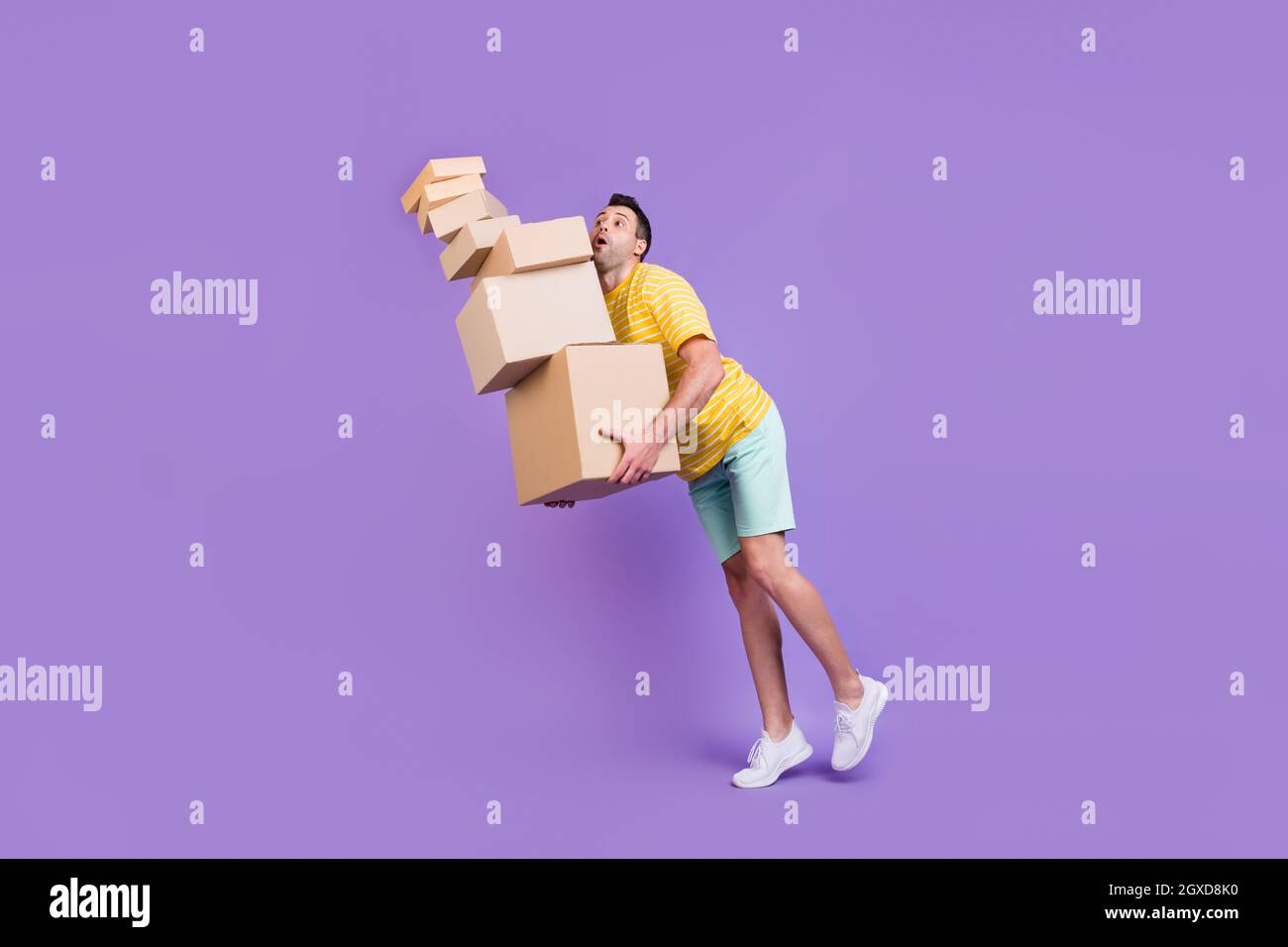 Full length body size photo man walking with falling carton boxes ...