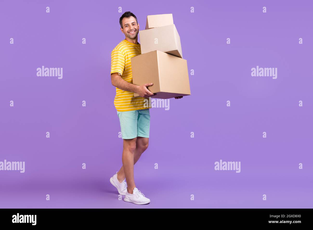 Full body photo of happy cheerful man hold hand boxes smile move houses ...