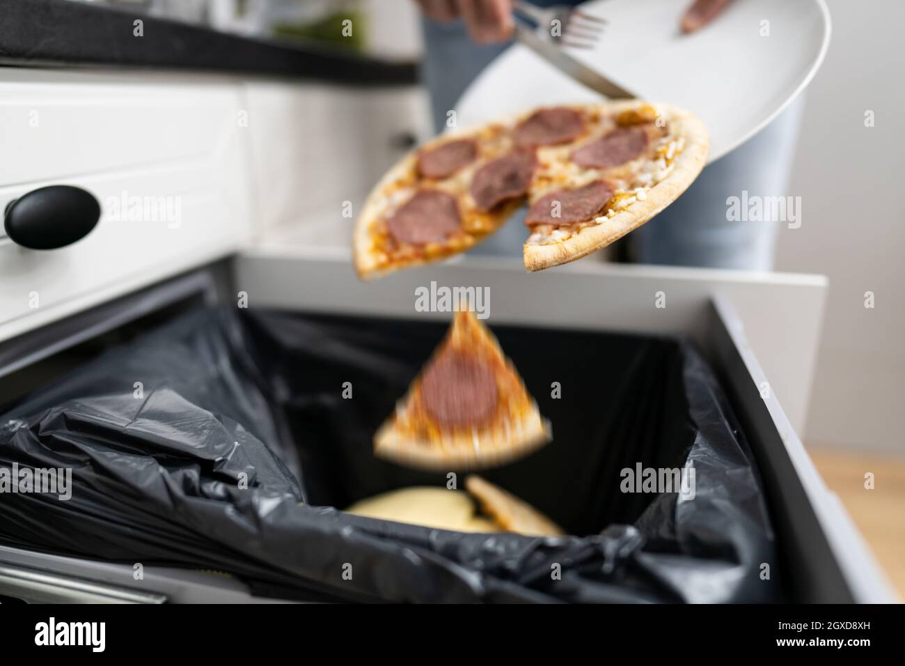 Man throwing food in bin hi-res stock photography and images - Alamy