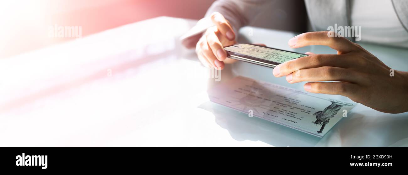 Remote Check Deposit Taking Photo With Mobile Phone Stock Photo - Alamy