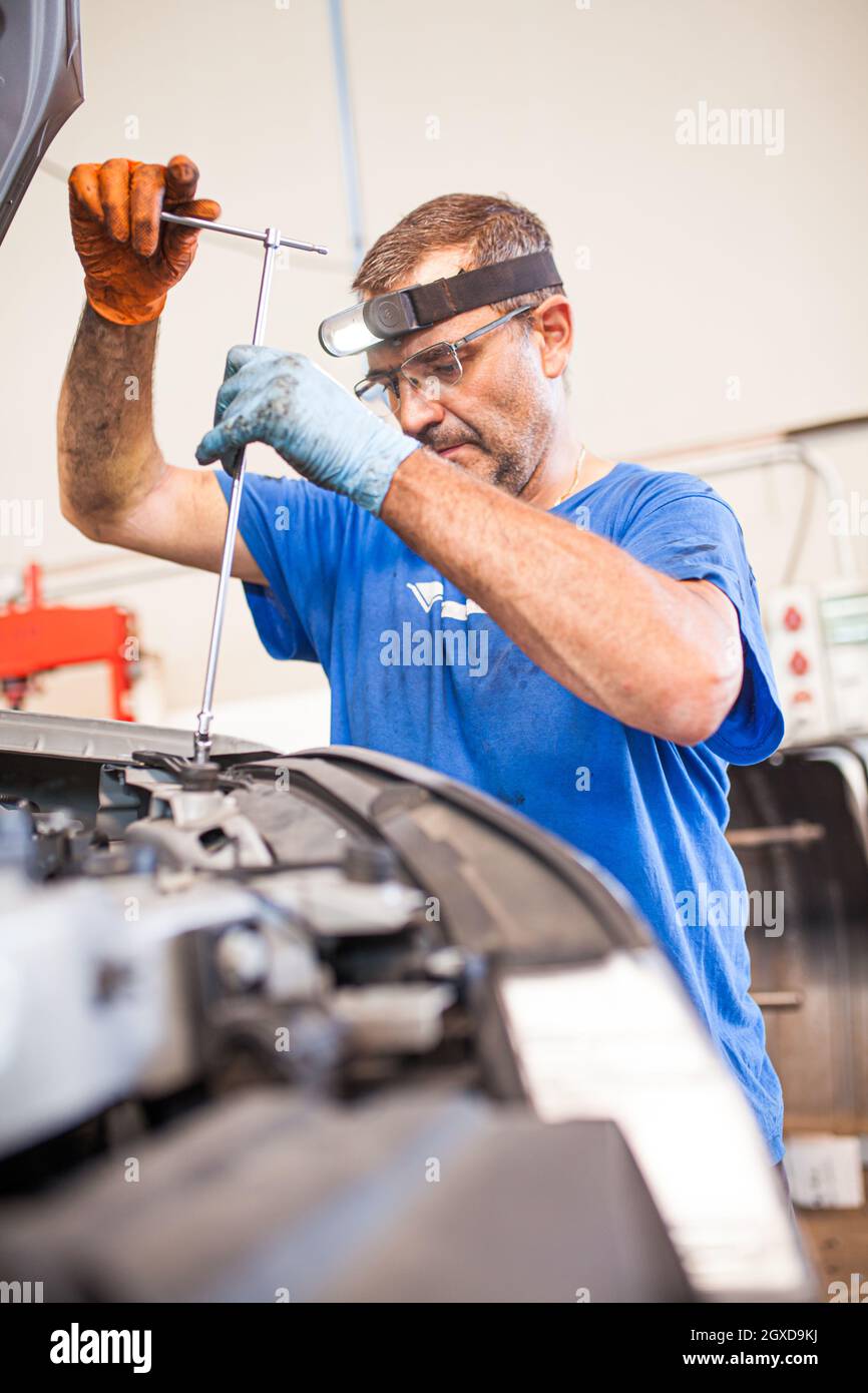 Busy mature male mechanic hi-res stock photography and images - Alamy