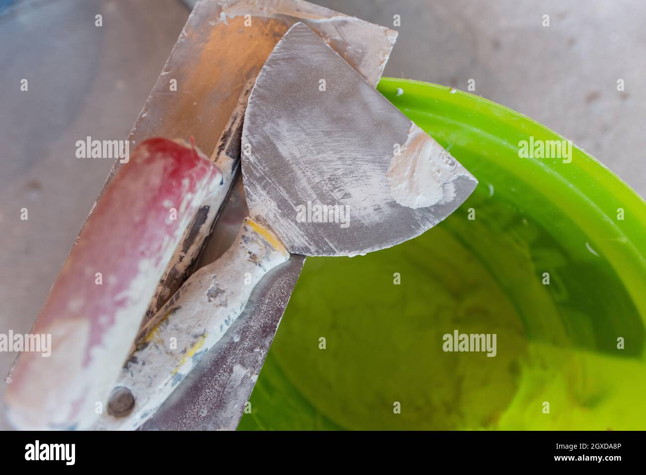 Top view of construction tools in bucket on concrete background. Set of ...
