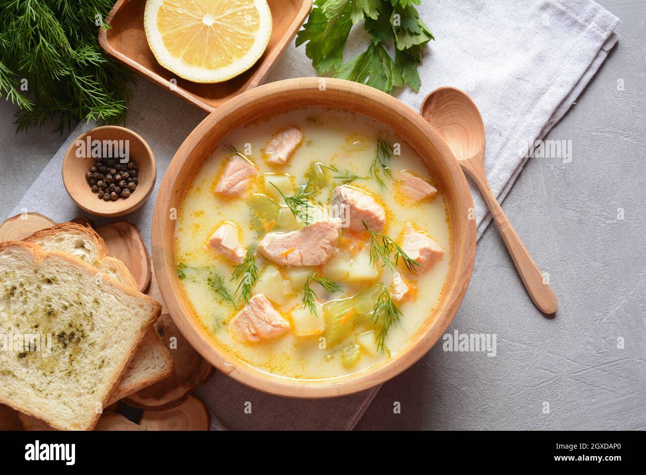 Creamy fish soup with salmon, potatoes, onions , carrots, dill and ...
