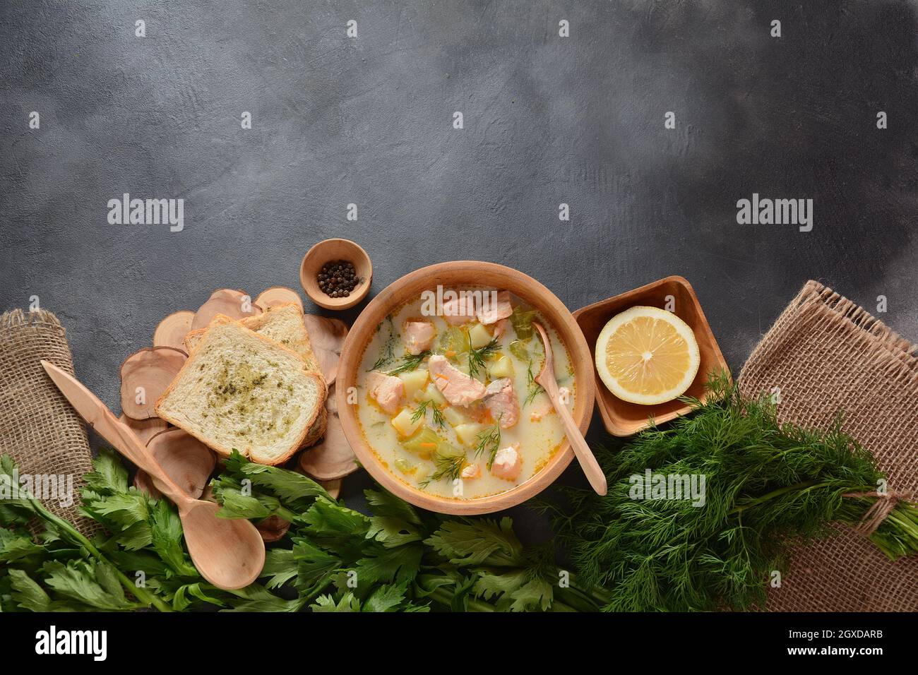 Creamy fish soup with salmon, potatoes, onions , carrots, dill and ...