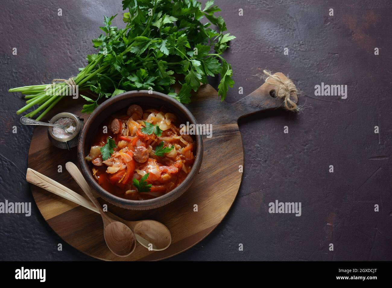 Cabbage stew with grilled sausage in tomato sauce - traditional dish of ...