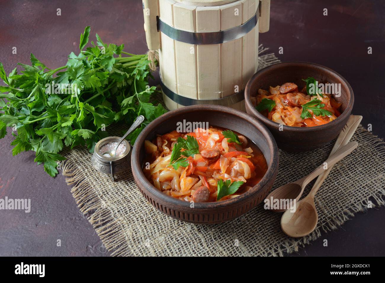 Cabbage stew with grilled sausage in tomato sauce - traditional dish of ...