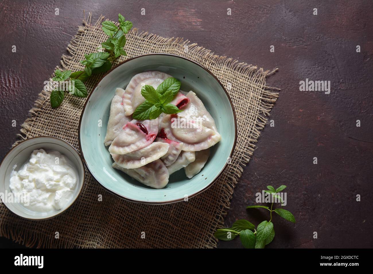 Dumplings with cherries,sour cream and mint. Ukrainian, Russian and ...