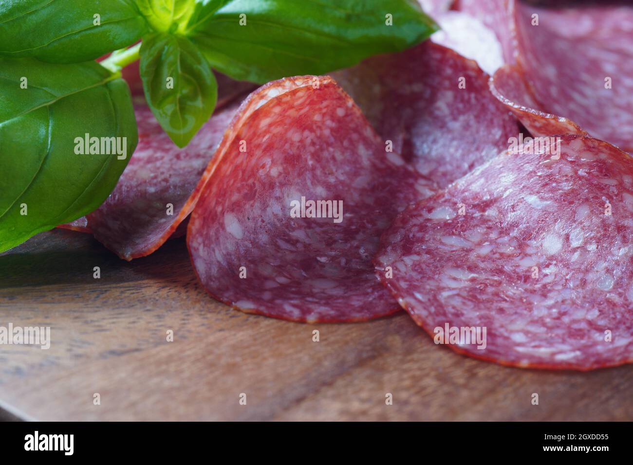 Sliced salami on cutting board Stock Photo - Alamy