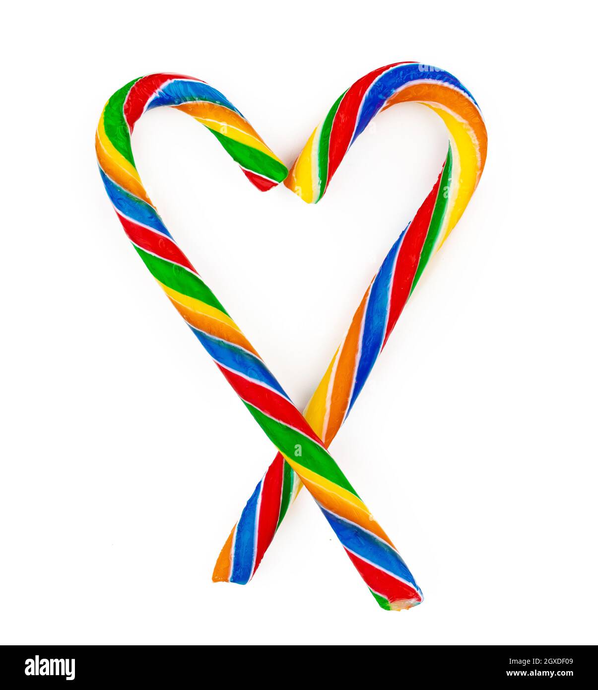 Rainbow colored candy cane isolated on white background Stock Photo - Alamy