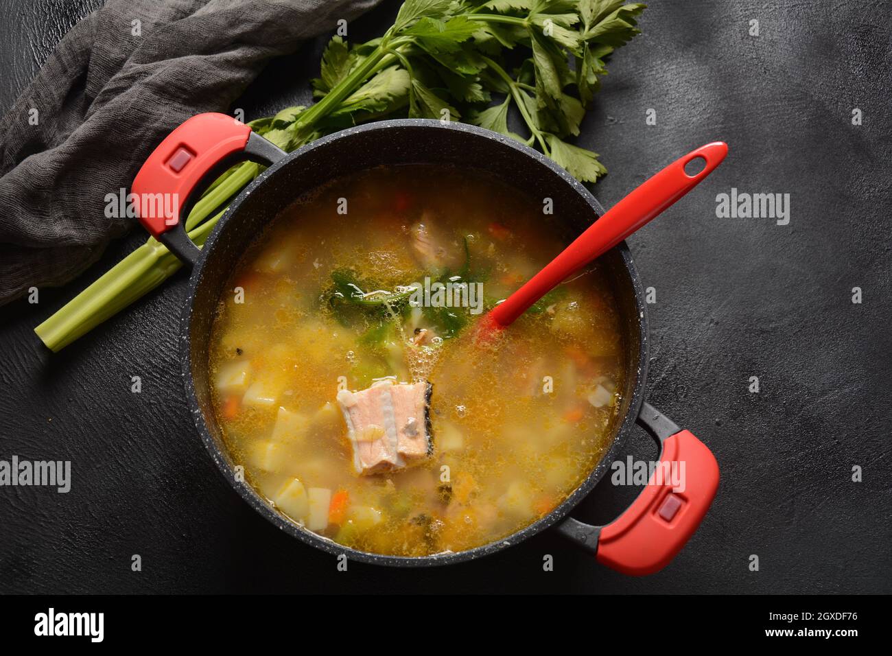 Fresh fish soup on black background. Salmon soup Stock Photo - Alamy Fresh fish soup on black background. Salmon soup Stock Photo - Alamy