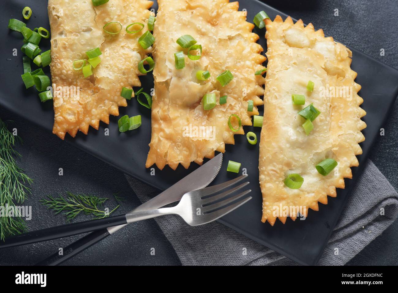 Cheburek with meat and spring onion Stock Photo - Alamy