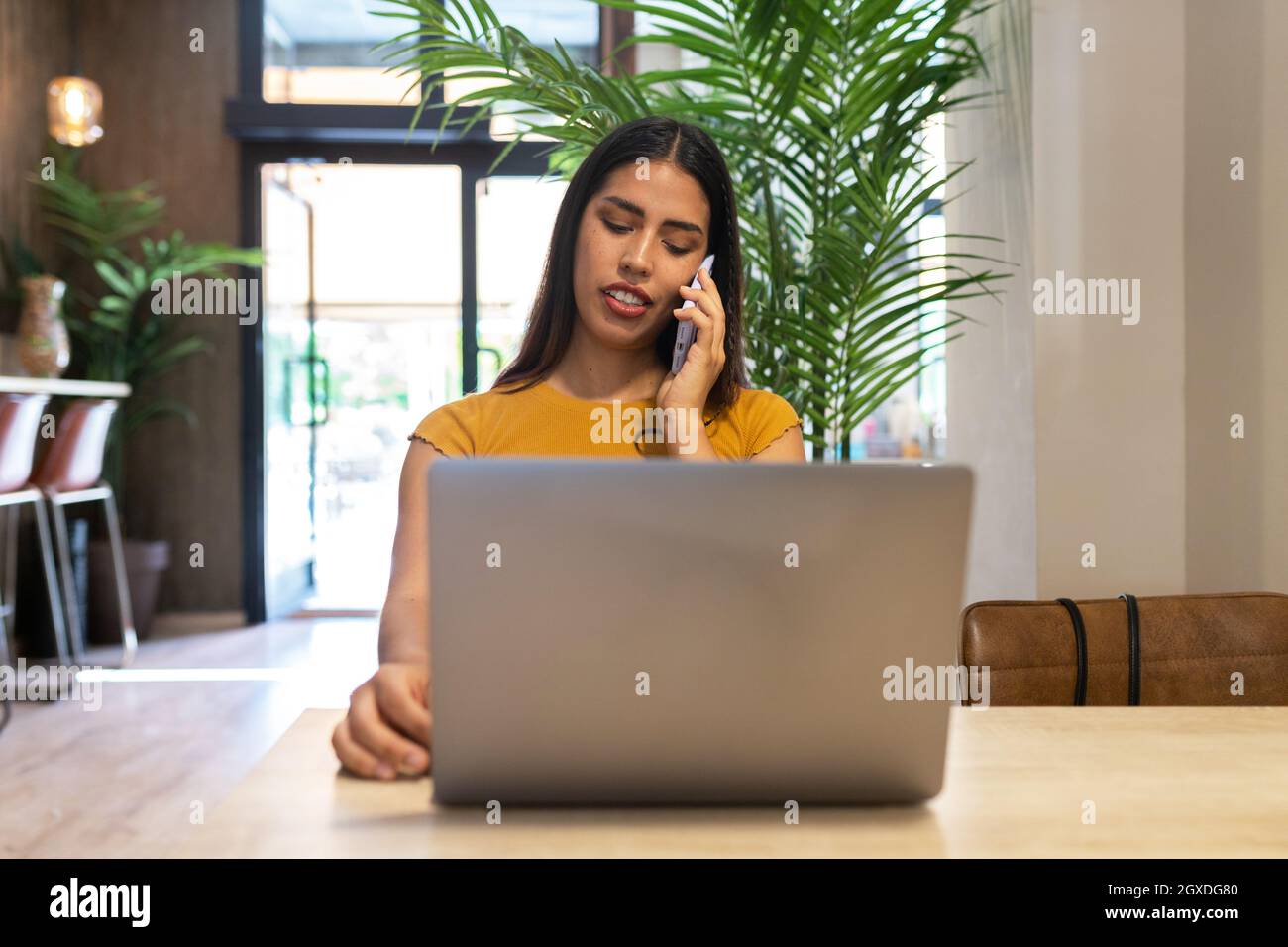 Happy millennial slim female model with ponytail wearing casual cropped ...