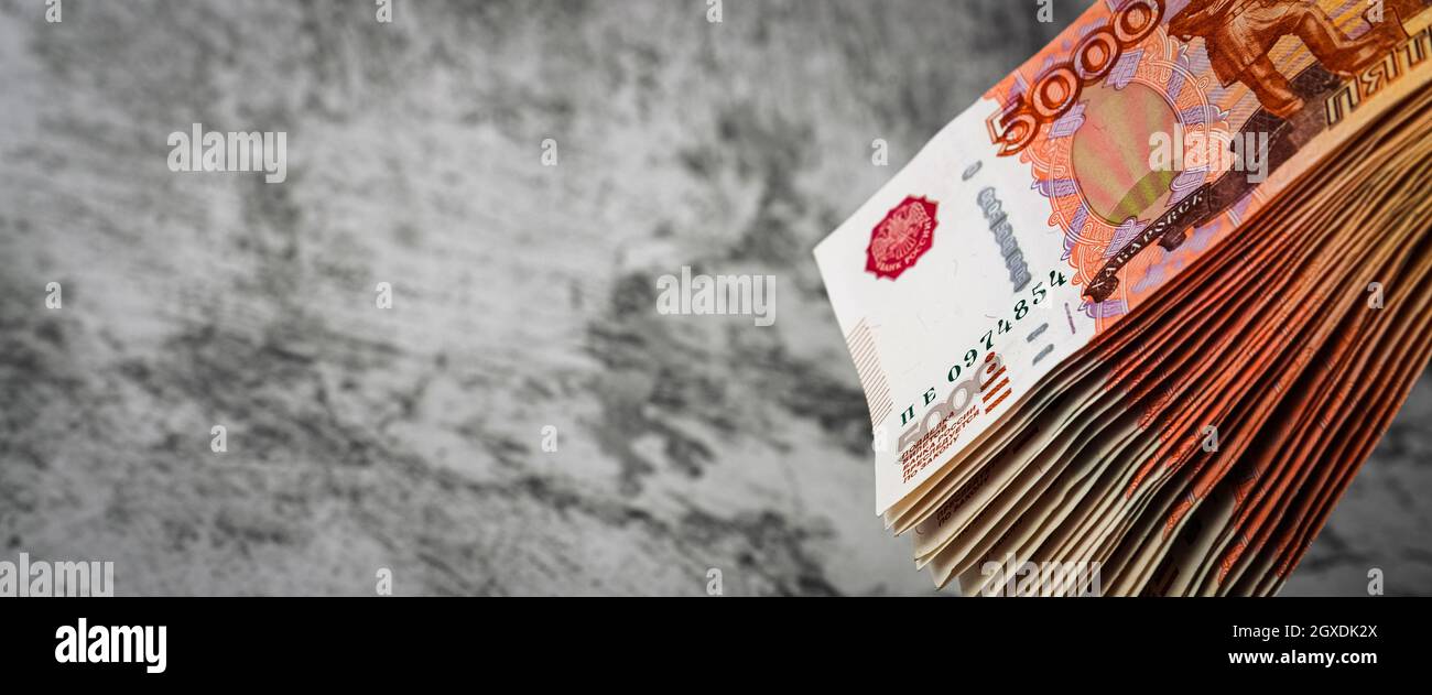 Russian rubles a large bundle on a gray background. A bundle of five ...