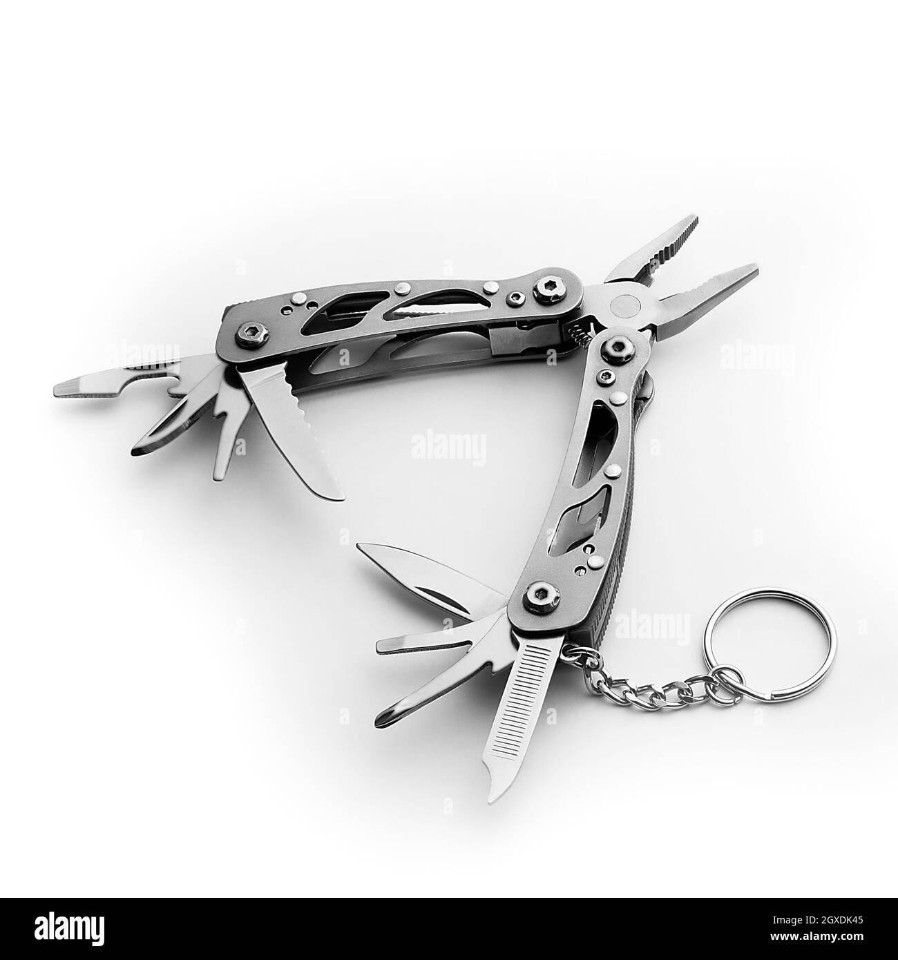 Multi tool with expanded tools and pliers isolated on a white ...