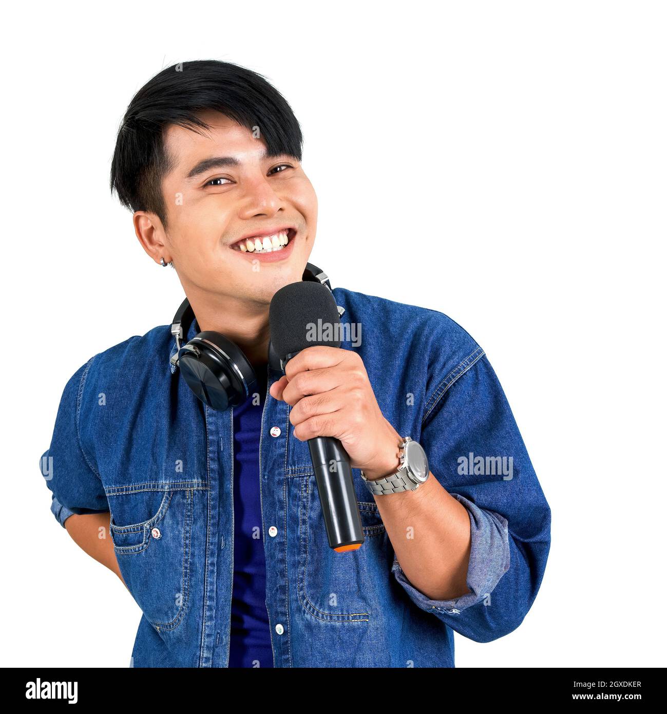 Young asian man in blue jean singing with microphone. Portrait on white ...