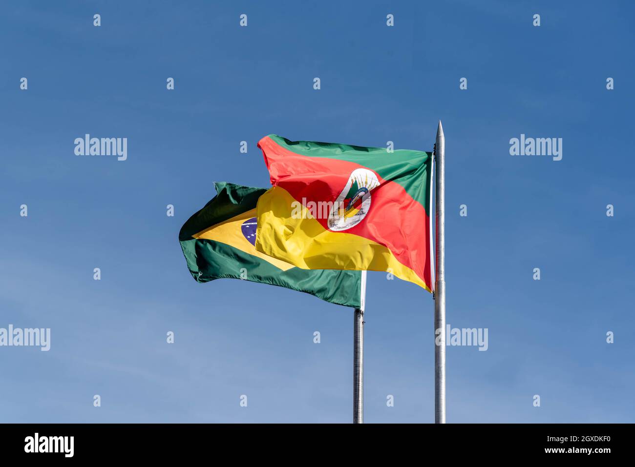Flags of the state of Rio Grande do Sul and Brazil on blue natural ...