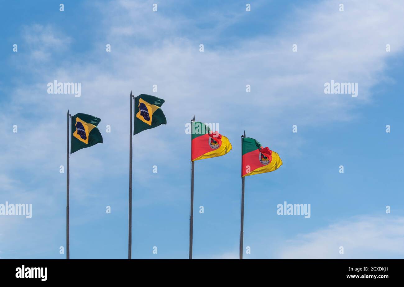 Flags of the state of Rio Grande do Sul and Brazil on blue natural ...