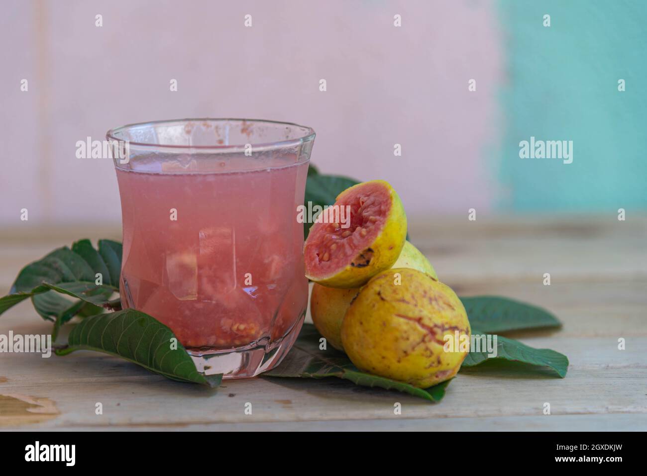Glass of guava juice. Detox juice. Natural and refreshing drink. Guavas ...
