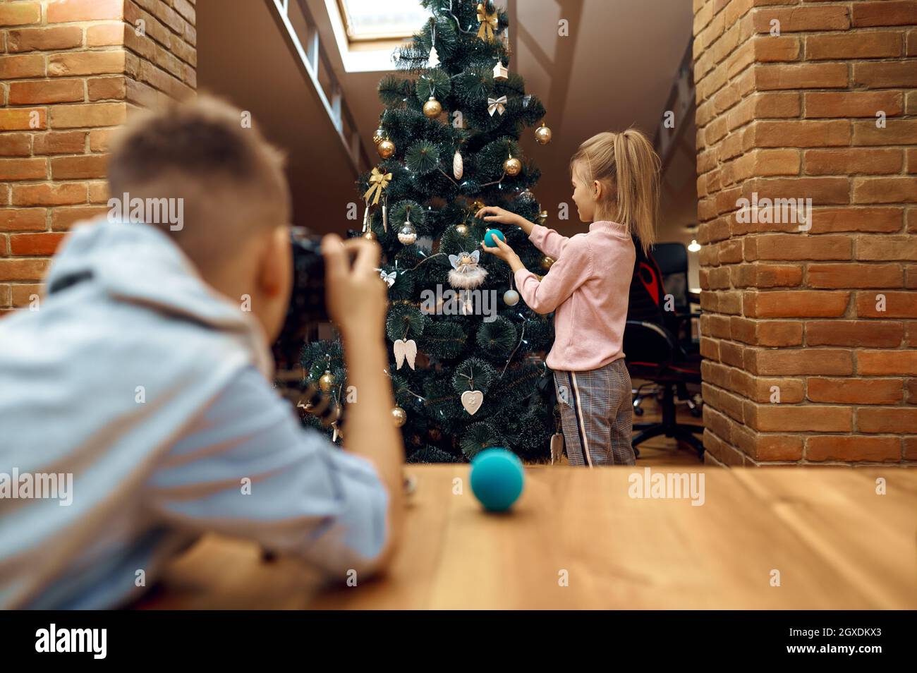 Children bloggers recording christmas blog on camera, vlog. Kids ...