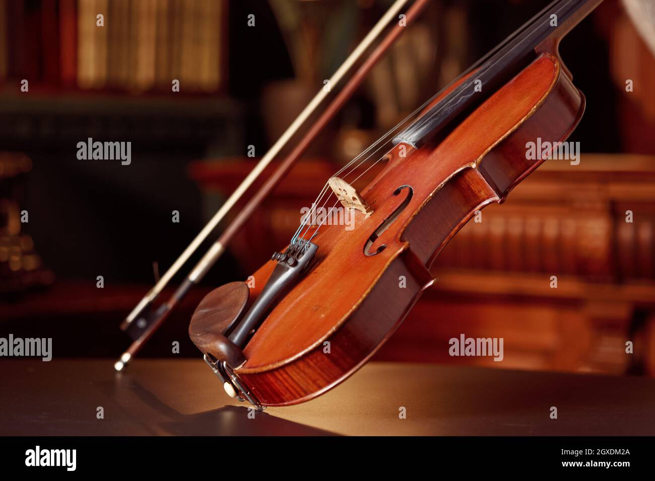 Violin in retro style and bow, closeup view, nobody. Classical string ...