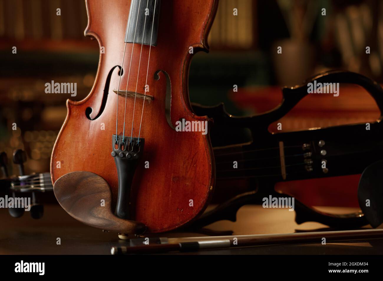 Violin in retro style and modern electric viola, closeup view, nobody ...