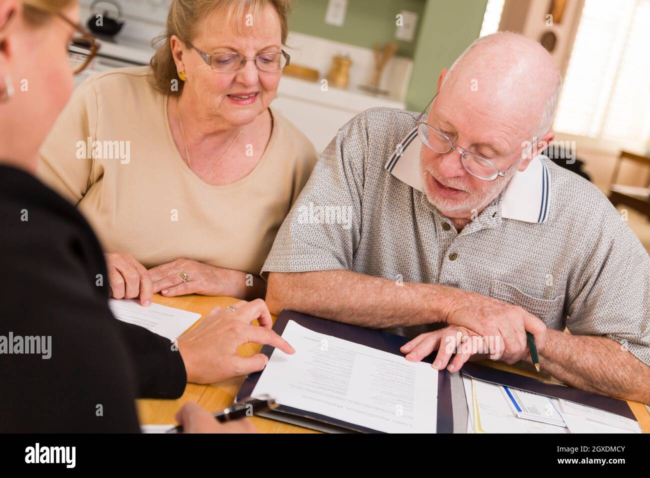 Couple going over paperwork hi-res stock photography and images - Alamy