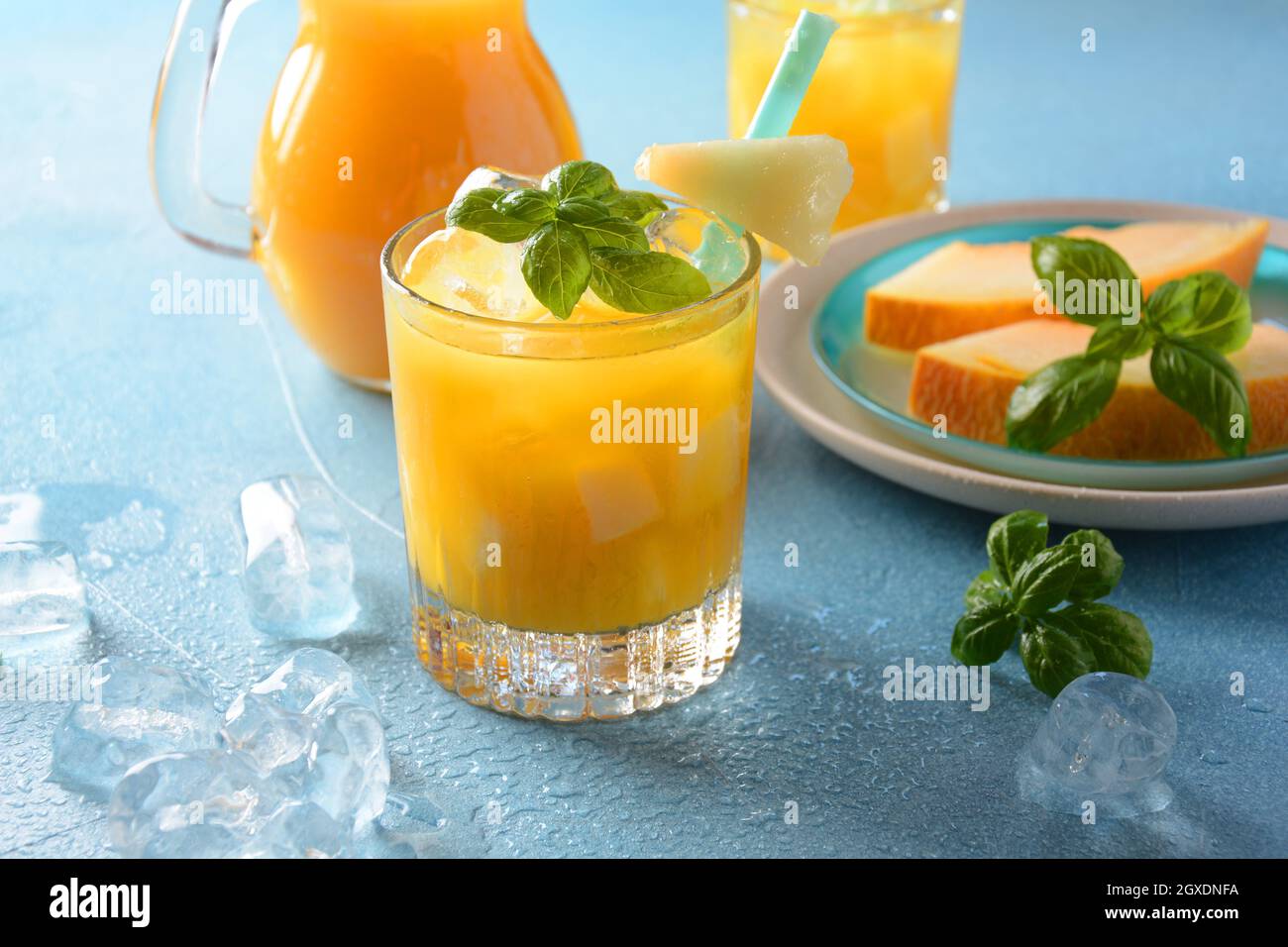 Refreshing drinks and citrus juices with ice cubes, mint and melon ...