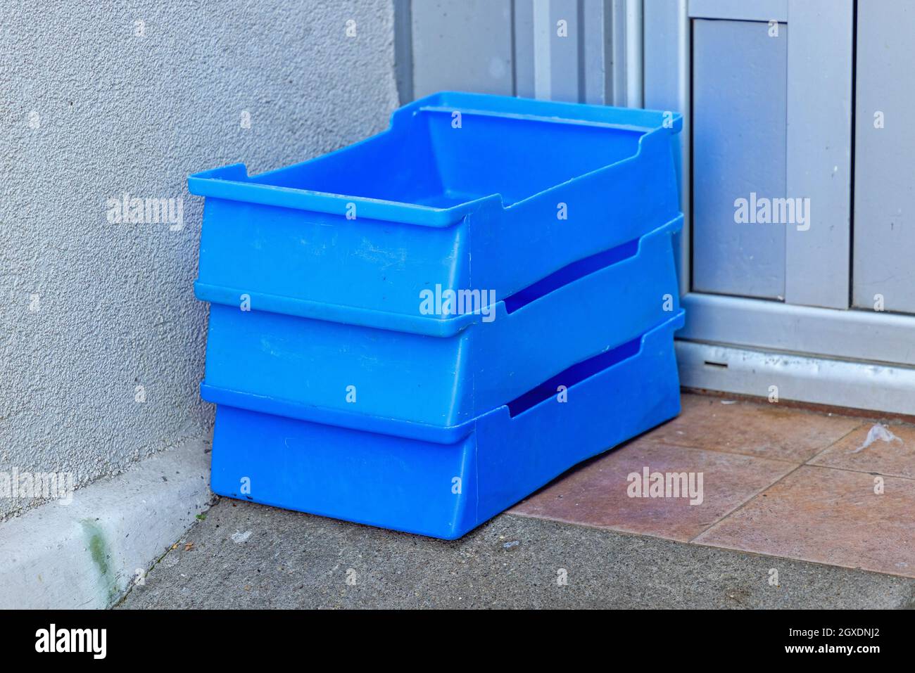 Stacked Milk Crates in Front of Shop Door Delivery Stock Photo - Alamy