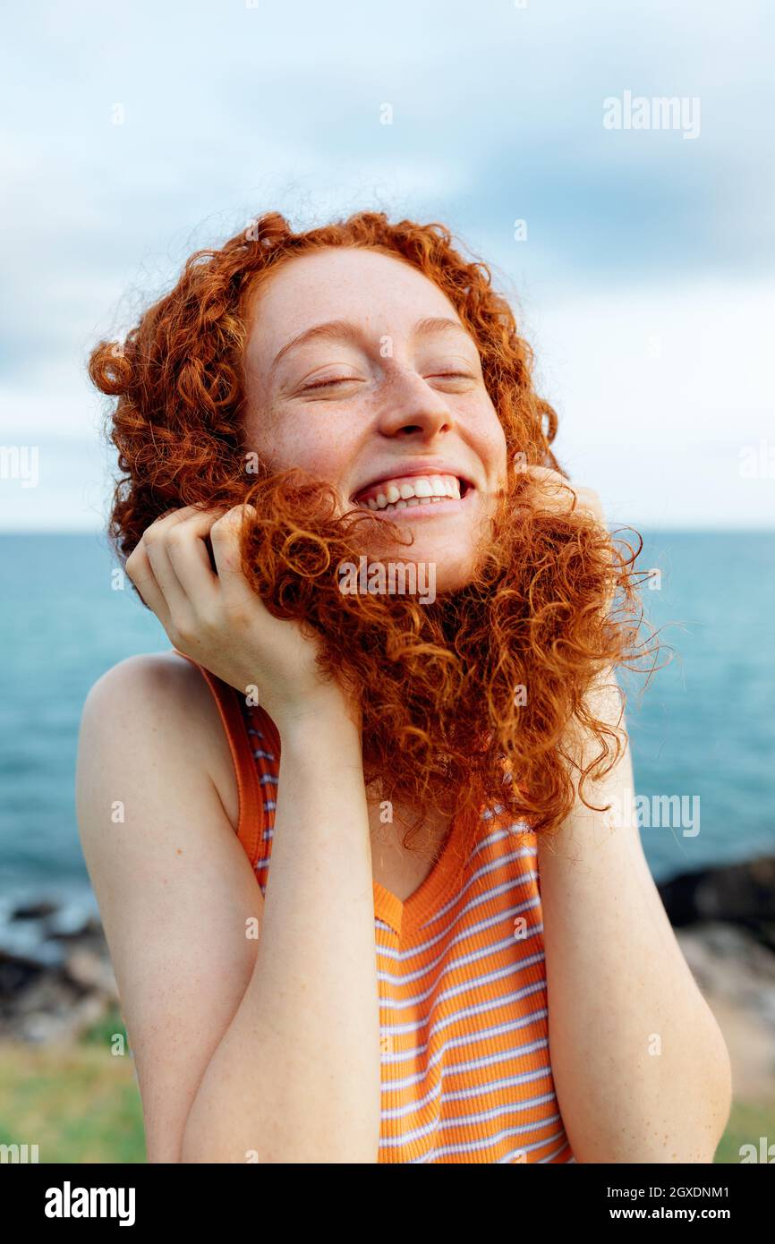 Back view faceless male with long curly hair wearing white shirt ...