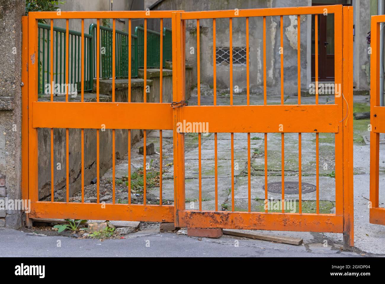 Orange Metal Bars Gate Entrance to Car Parking Place Stock Photo - Alamy