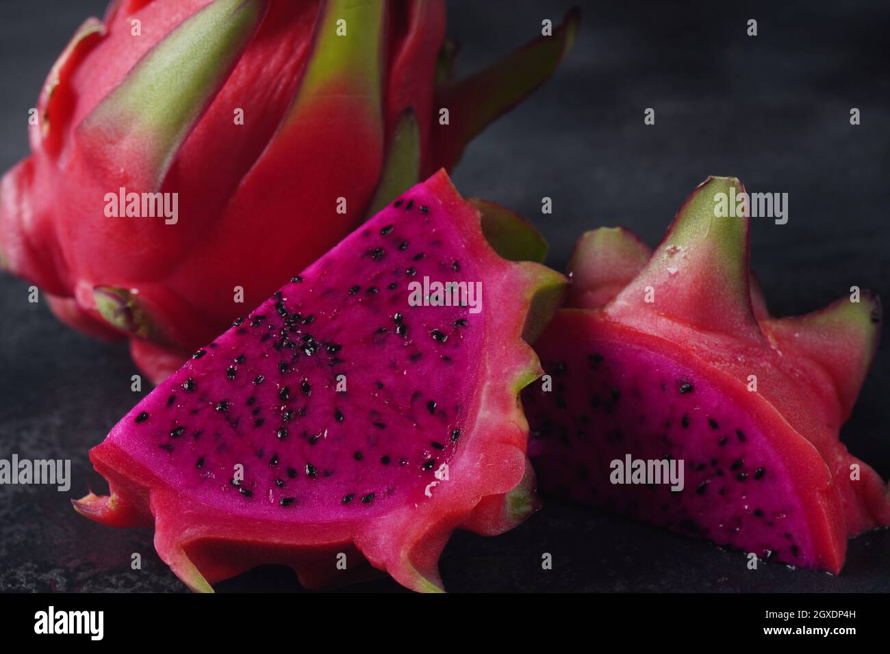 Dragon fruit (Pitaya, Pitahaya) Cut into half, one whole, two sliced ...