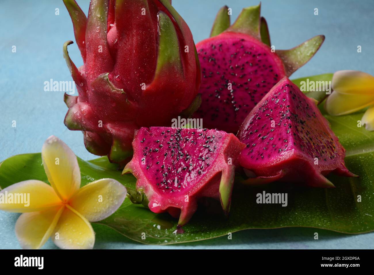 Dragon fruit (Pitaya, Pitahaya) Cut into half, one whole, two sliced ...