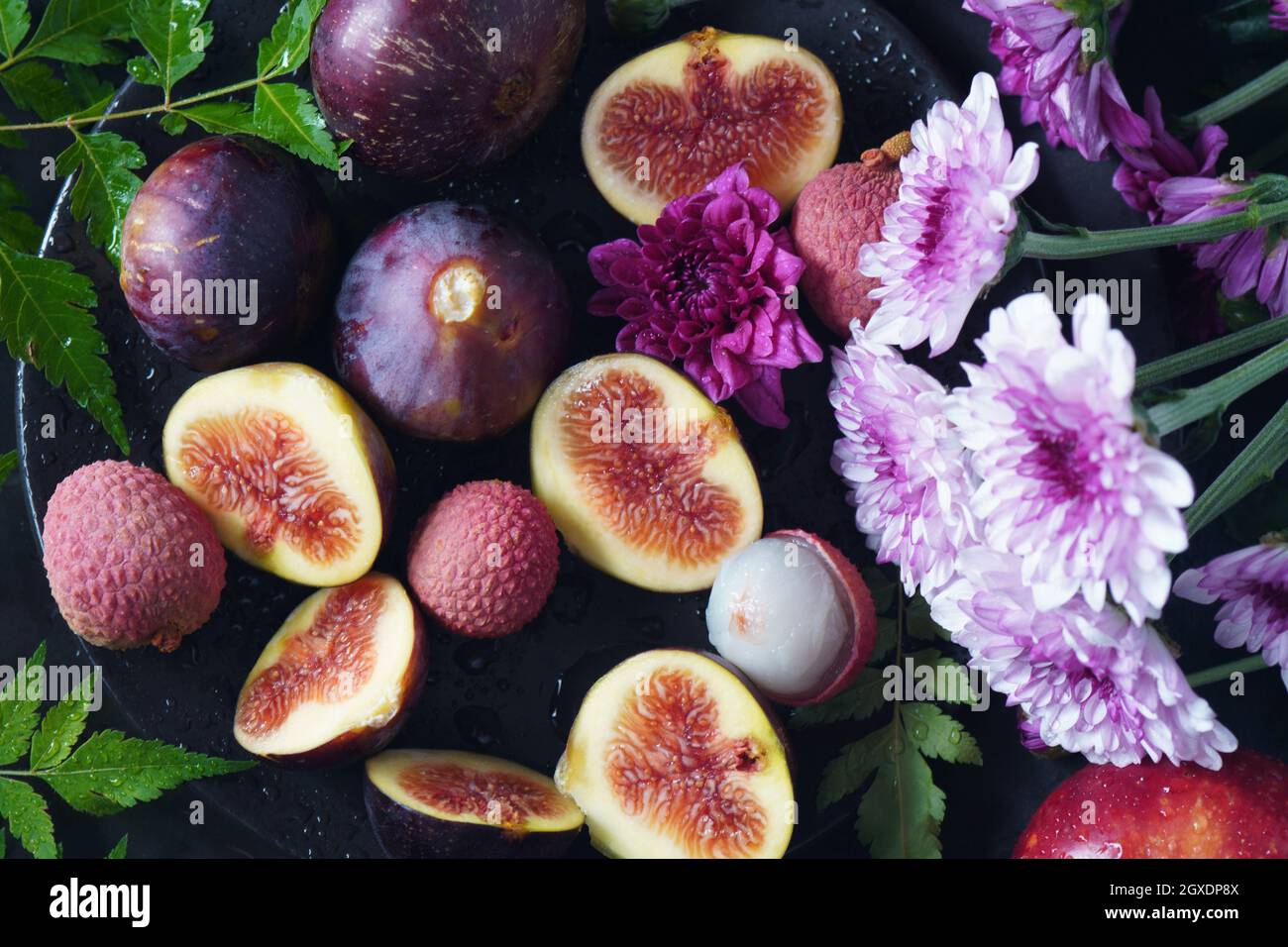 Raw fresh fig fruits on dark background. Slices of fresh common fig ...
