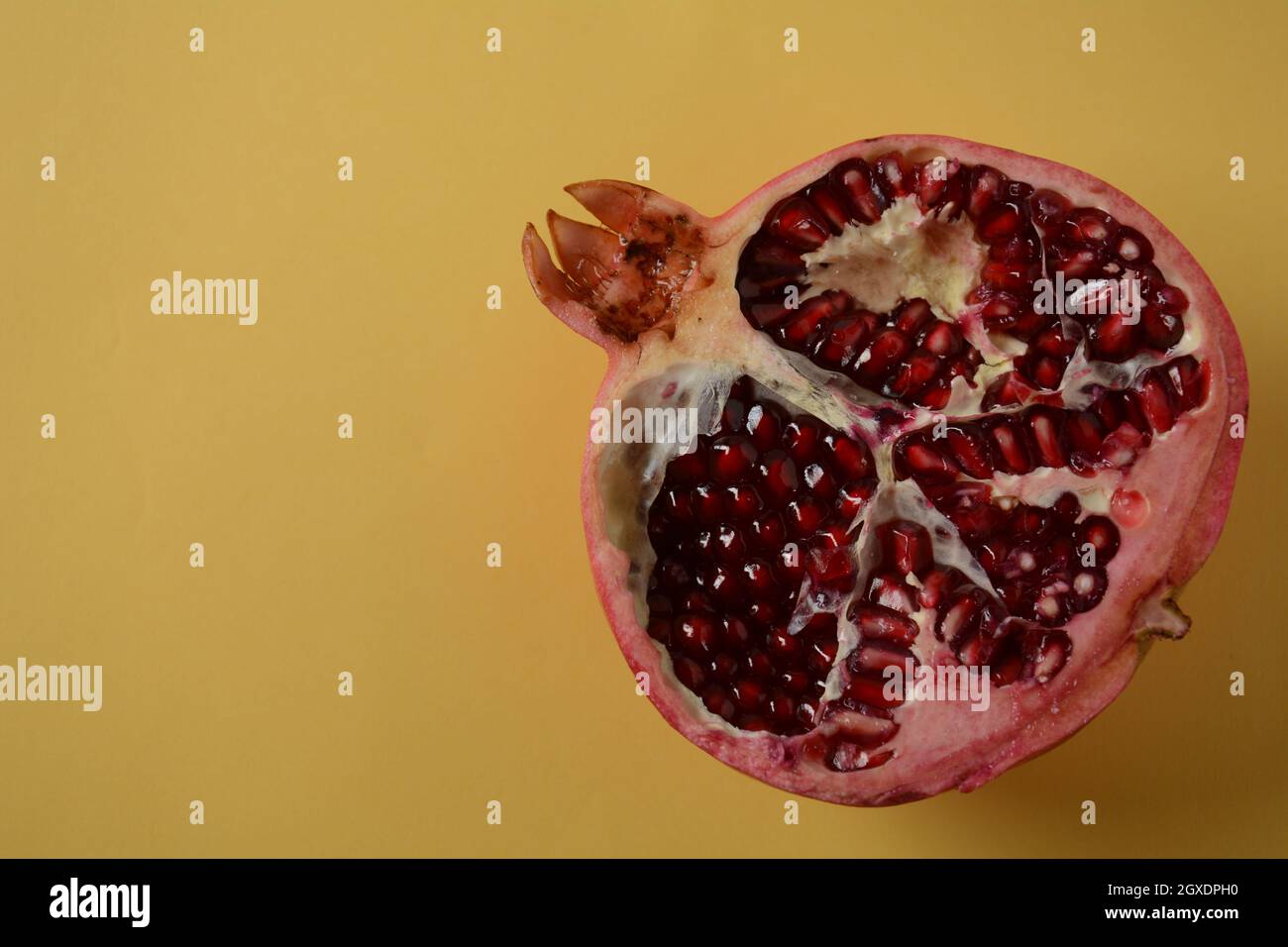 Fresh sliced pomegranates. Half pomegranate and pomegranate grains ...