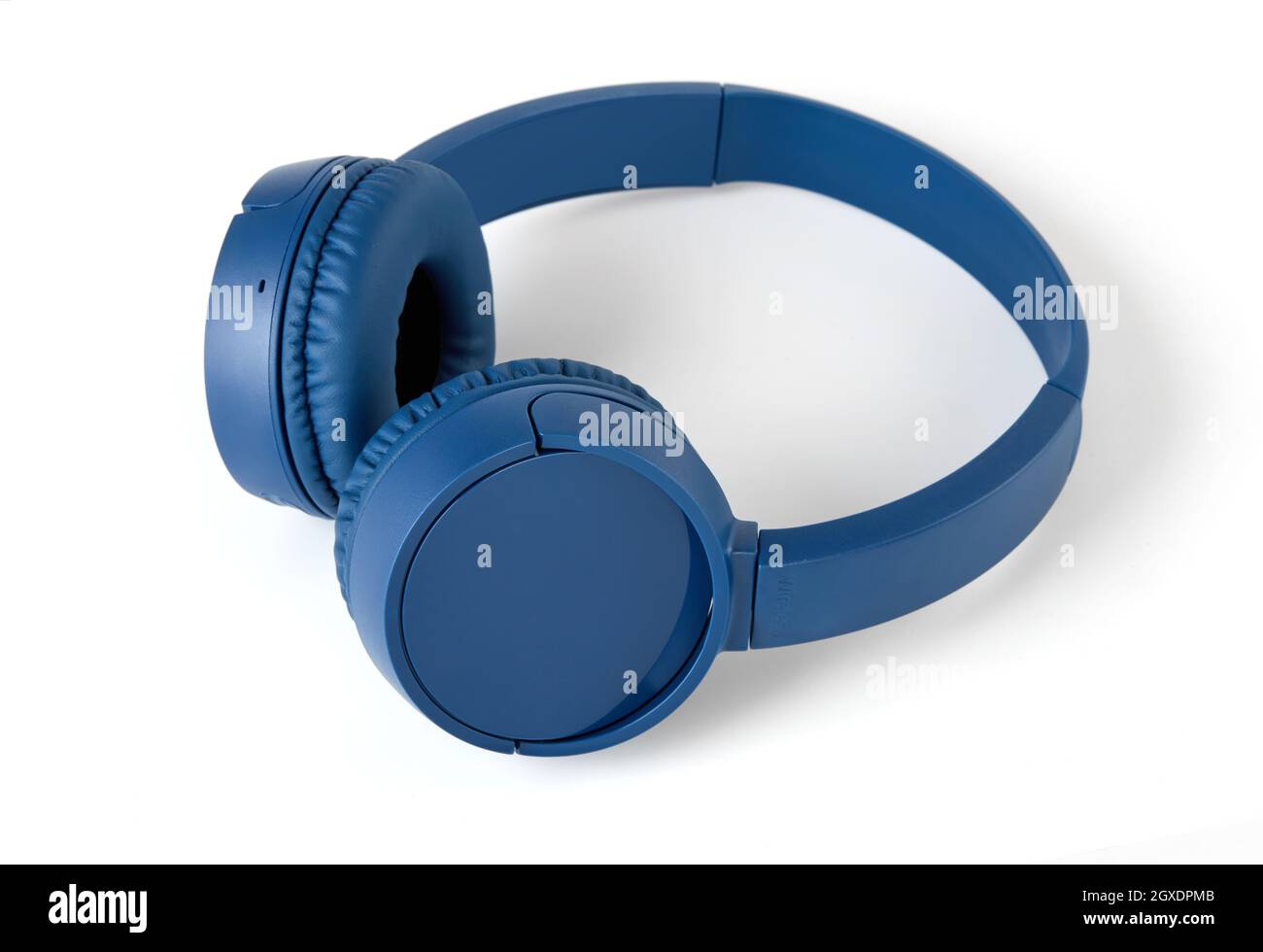 Wireless blue headphones on white background Stock Photo - Alamy