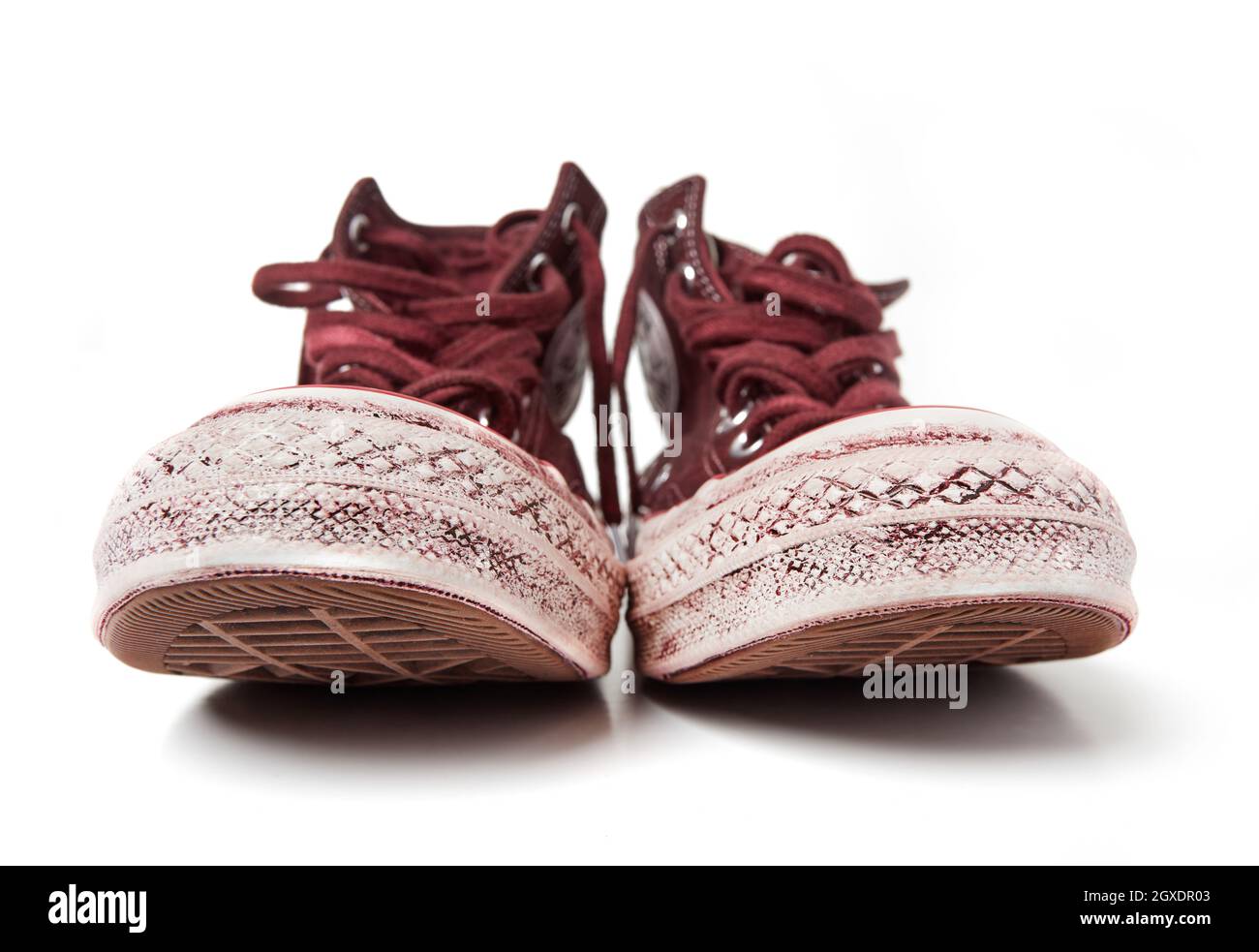 Used canvas shoes close-up on white background Stock Photo - Alamy