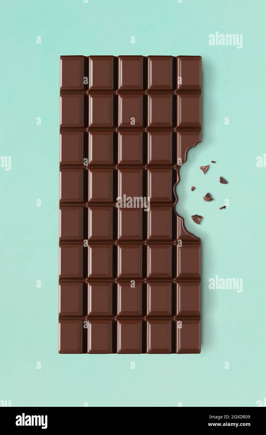 Chocolate bar with missing bite Stock Photo - Alamy