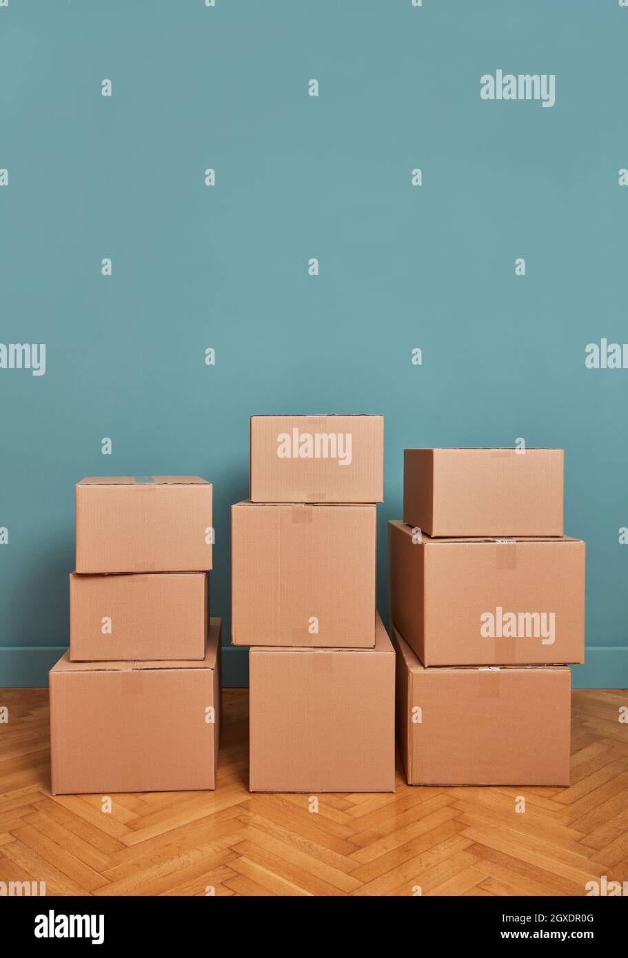 Cardboard boxes in room Stock Photo - Alamy